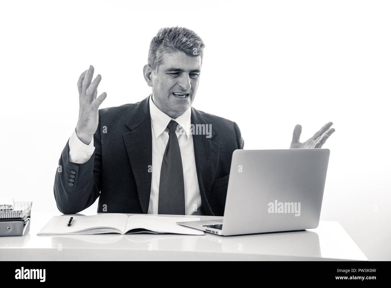 Angry and desperate businessman shouting with laptop computer and ...