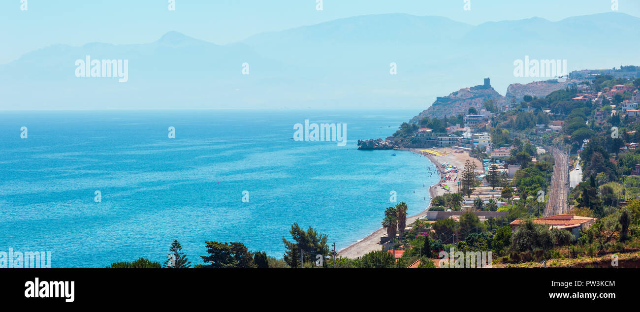 Azure Tyrrhenian sea bay and Rock of Capo Zafferano view from coastline ...