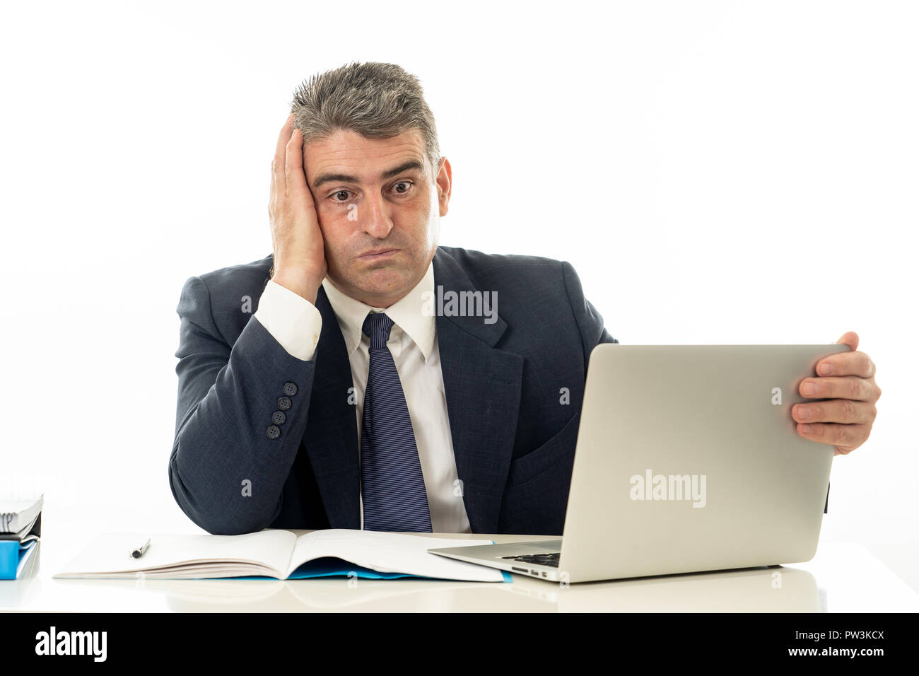 Angry and desperate businessman shouting with laptop computer and ...
