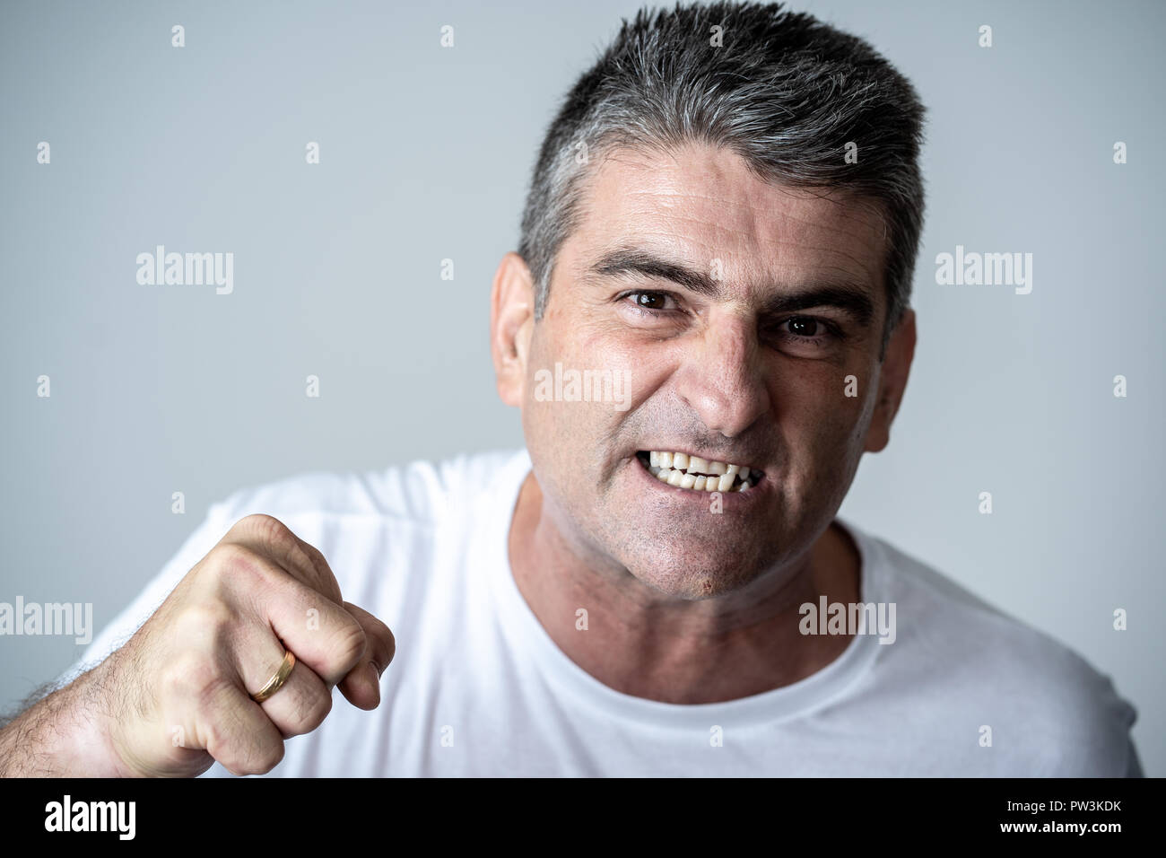 Portrait of a mature 40s to 50s white angry and upset man looking ...
