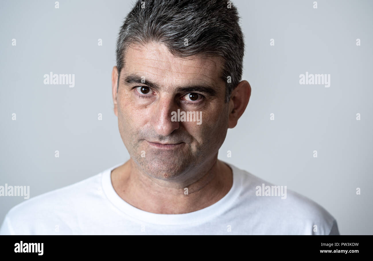 Portrait of a mature 40s to 50s white angry and upset man looking ...