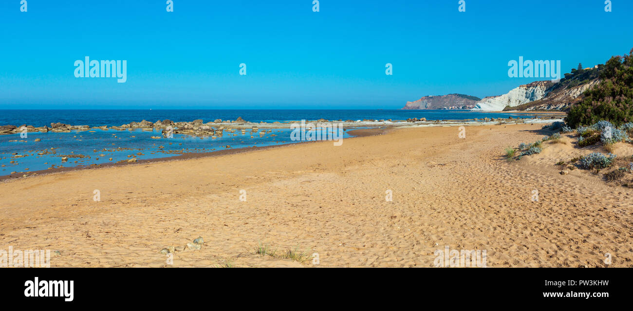 Sandy beach under famed white cliff, called "Scala dei Turchi", in ...