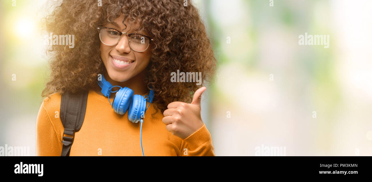 African american student woman smiling broadly showing thumbs up ...