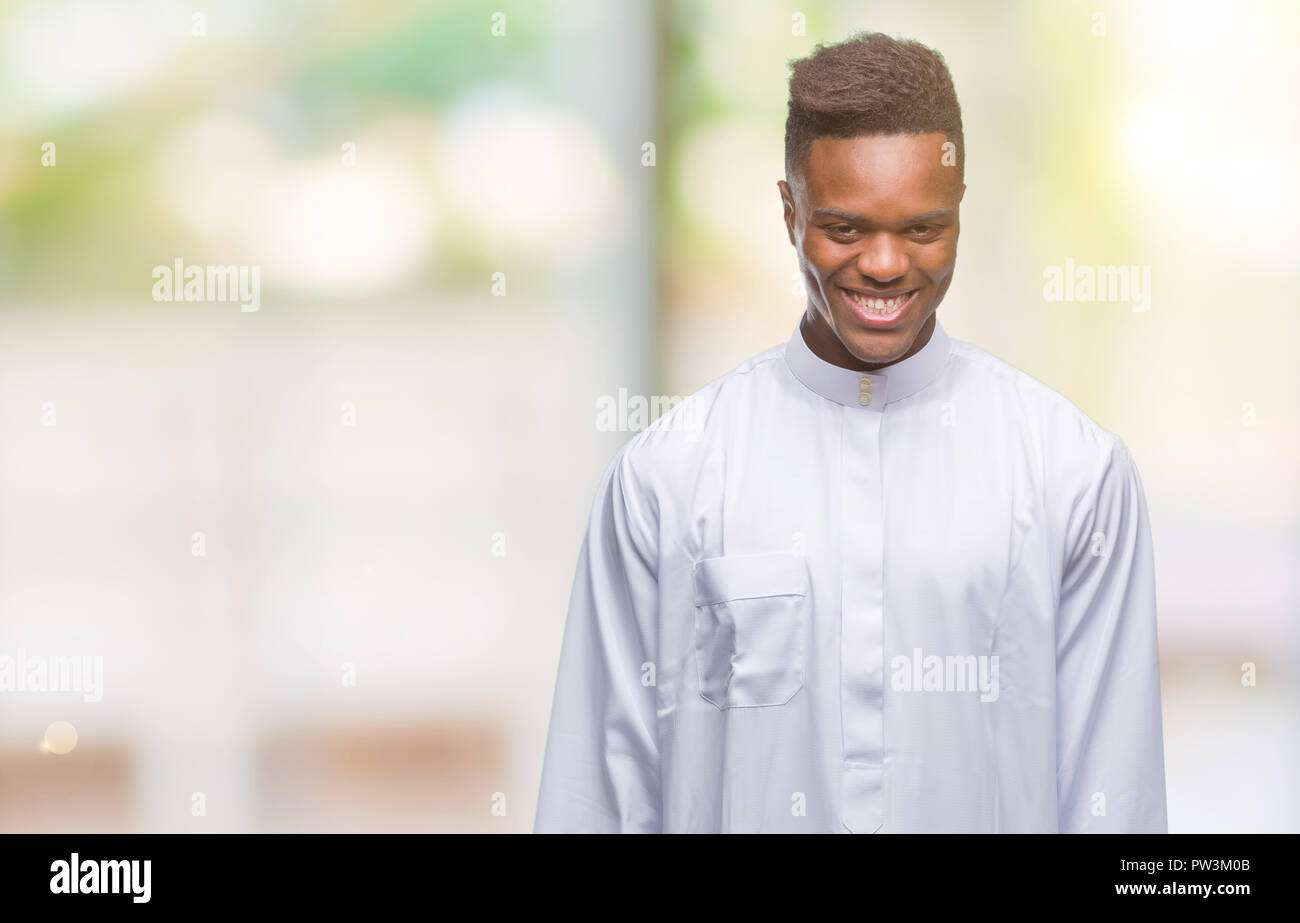 Young arabic african man wearing traditional djellaba over isolated ...