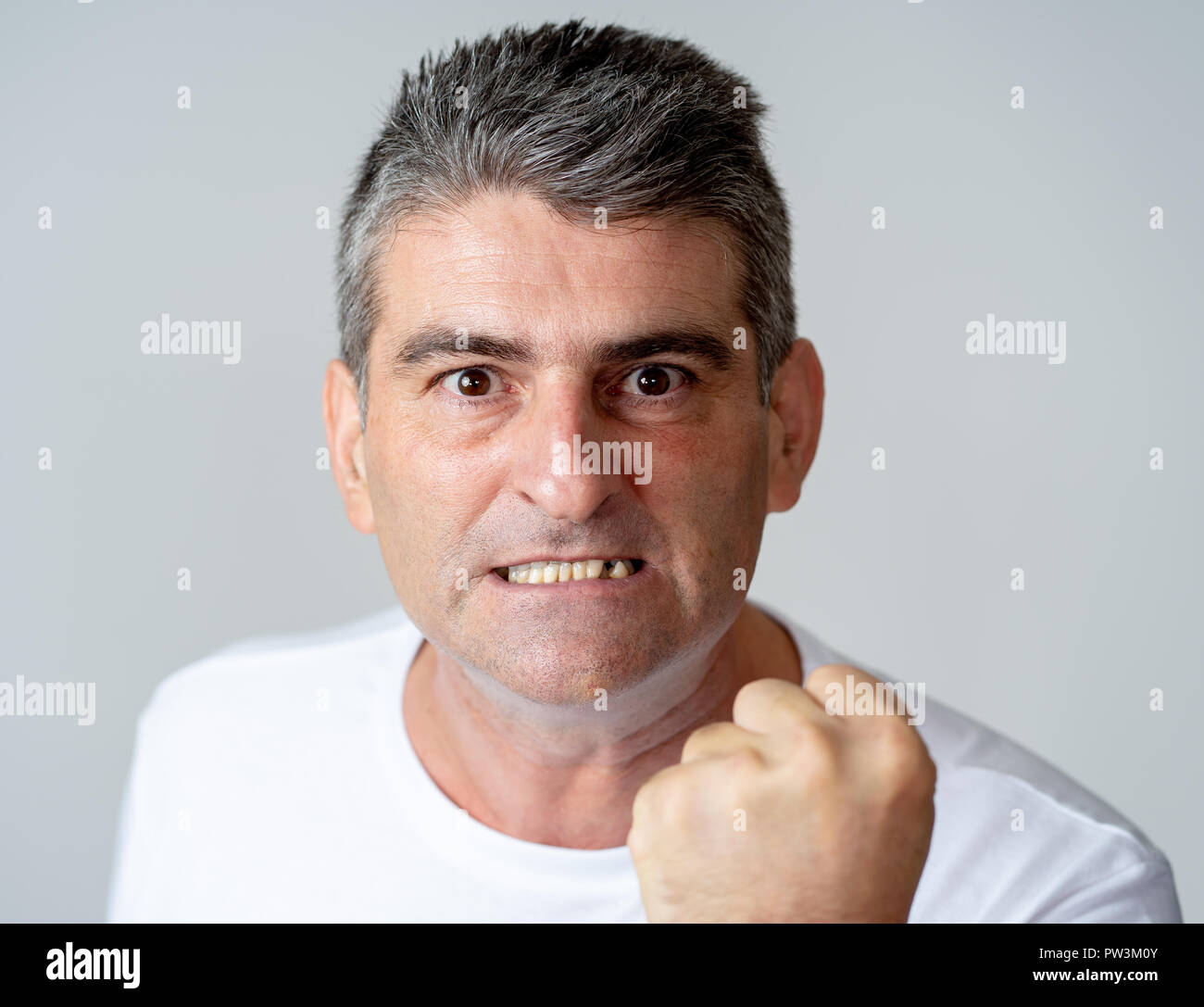 Portrait of a mature 40s to 50s white angry and upset man looking ...