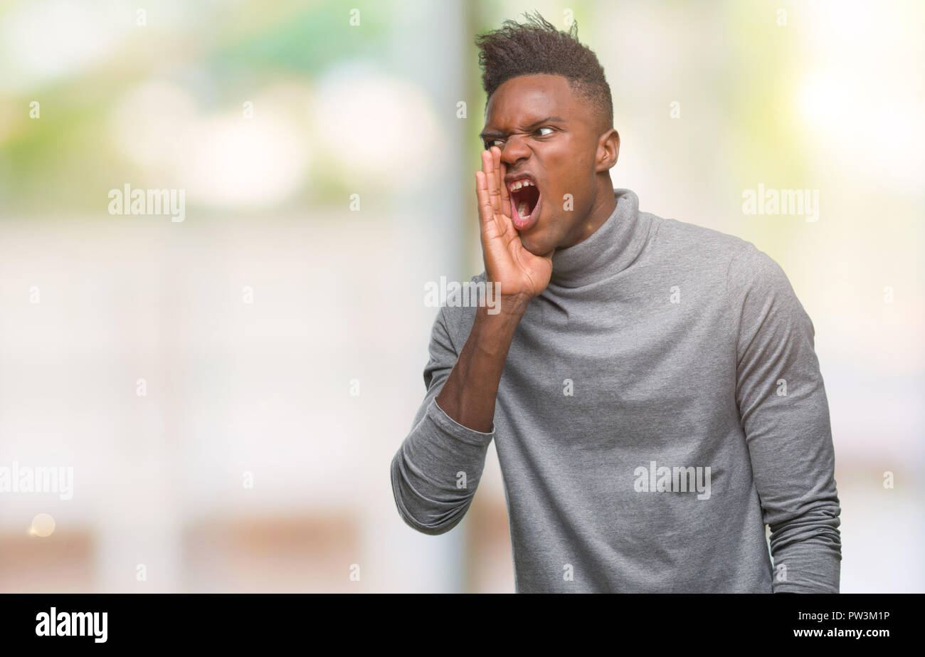 Young african man shouting screaming hi-res stock photography and ...