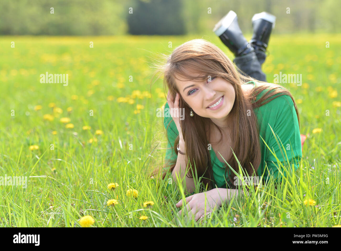 Beautiful girl on green grass Stock Photo - Alamy
