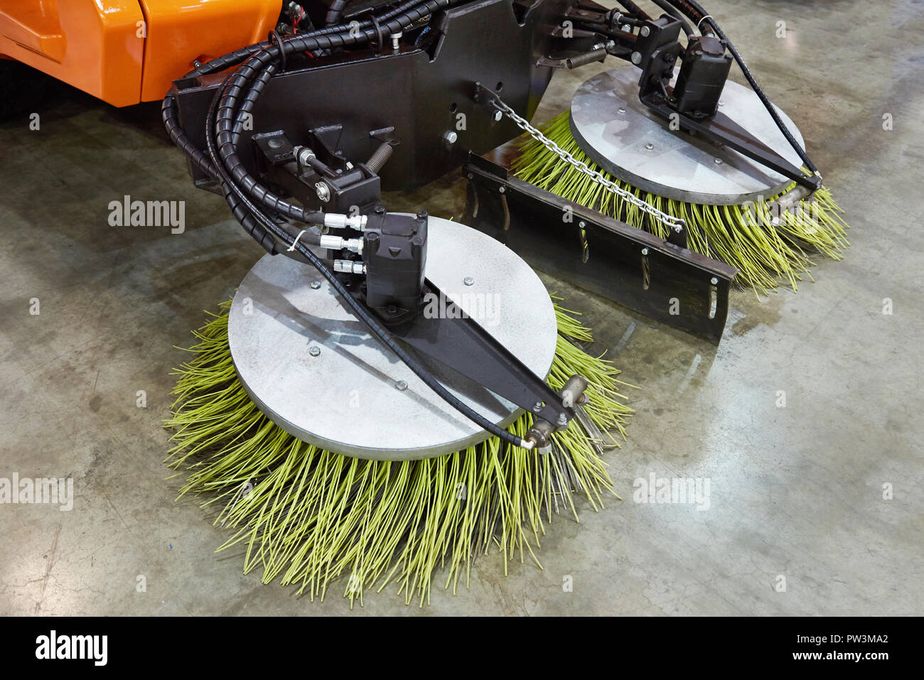 Round brushes for small street cleaning machine Stock Photo - Alamy