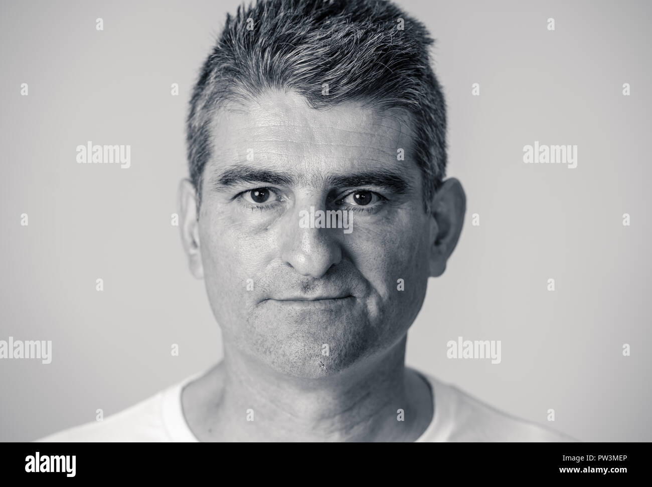 Portrait of a attractive mature man looking neutral relaxed and serious ...