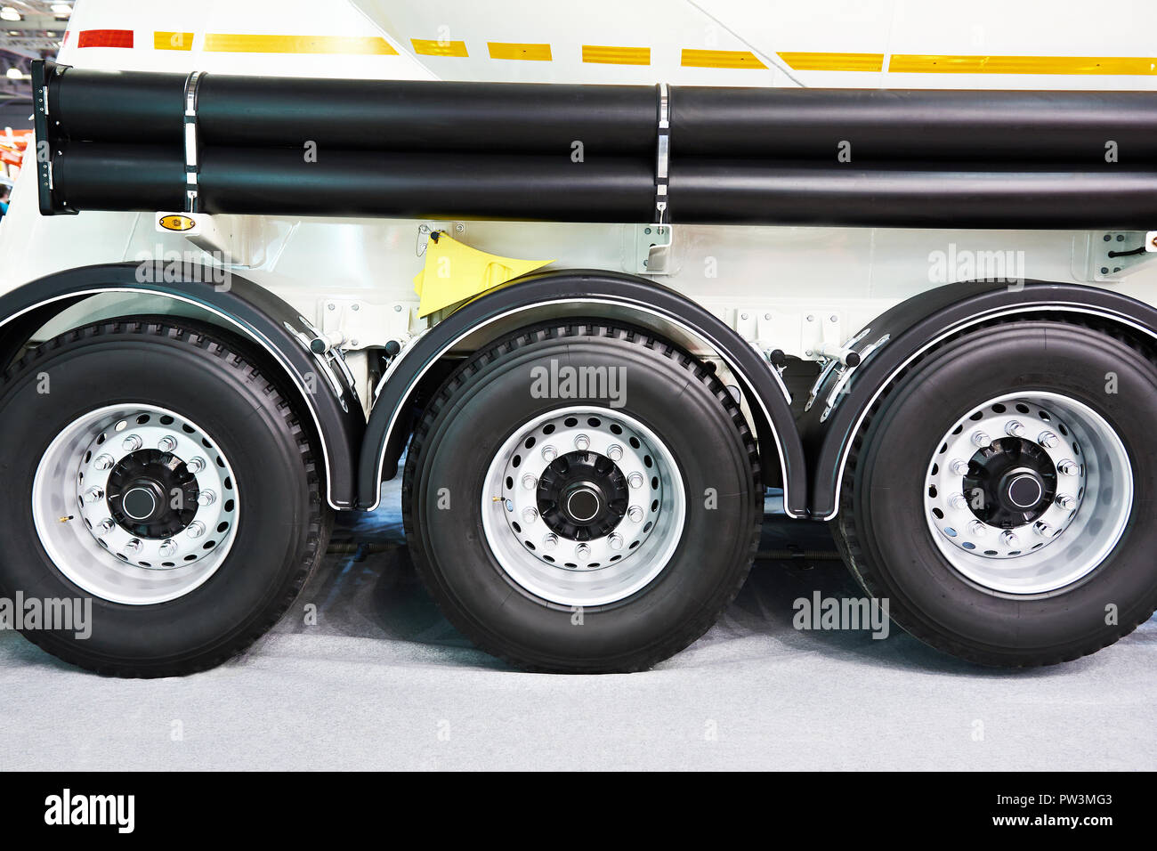 Three wheels semi-trailer with a tank Stock Photo - Alamy