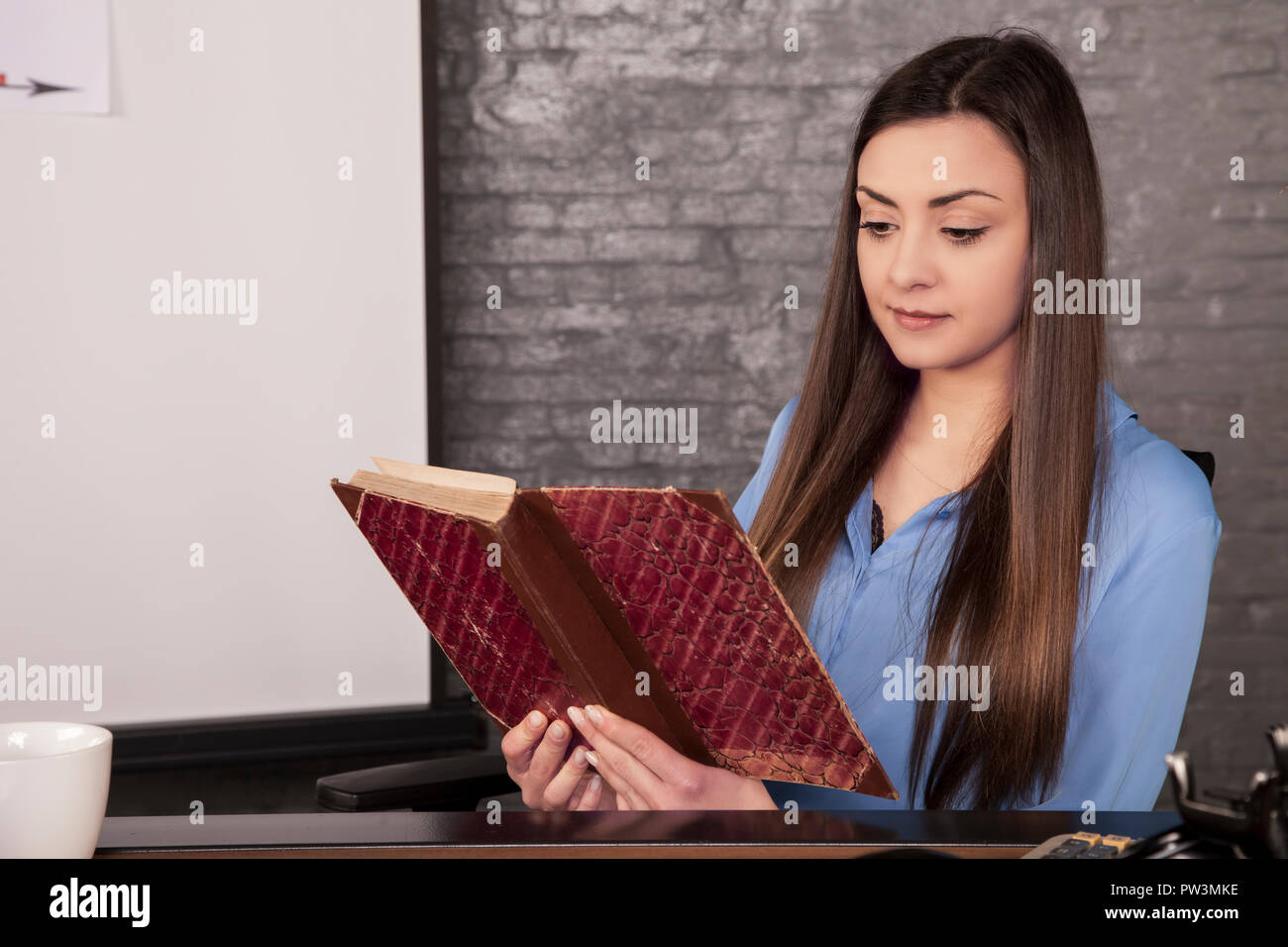 business woman working as a book reviewer Stock Photo - Alamy