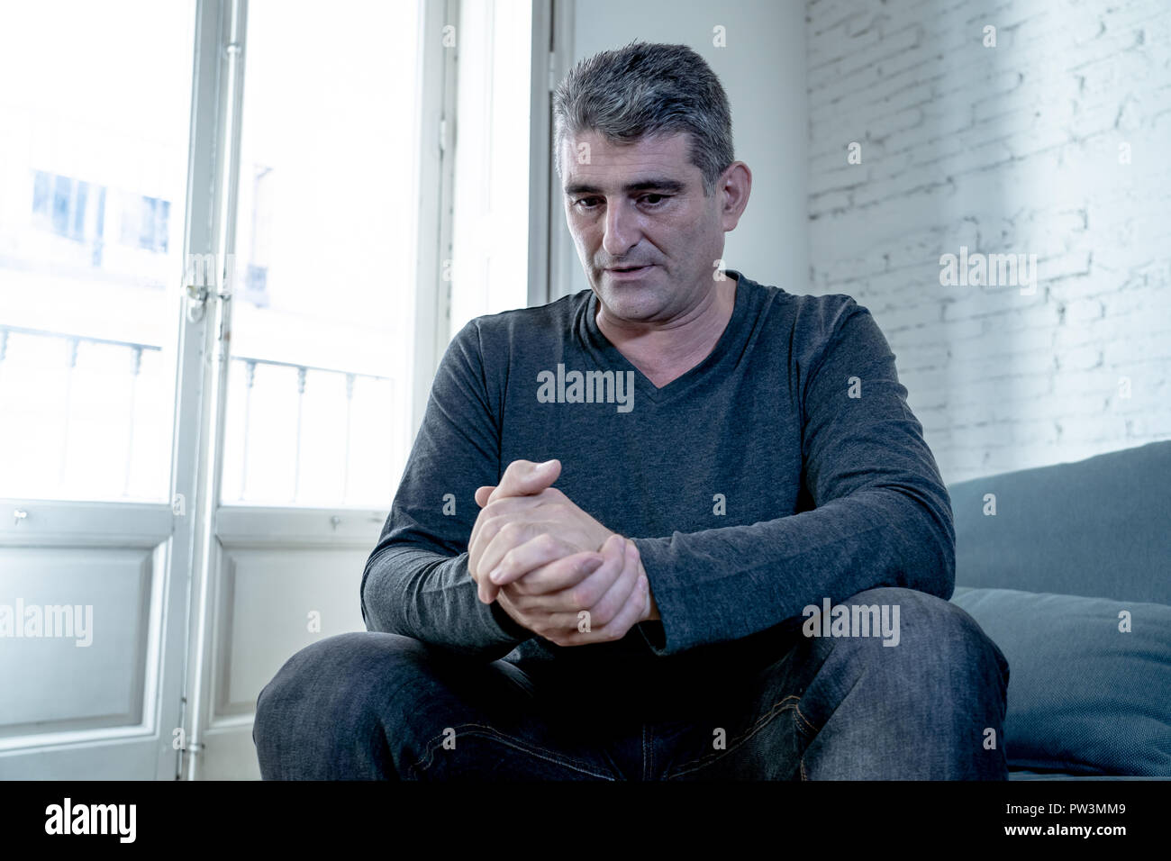 Sad middle age man hi-res stock photography and images - Alamy