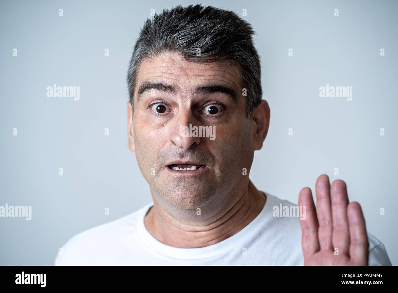 Portrait of a 40s 50s man in shock with a scared expression on his face ...