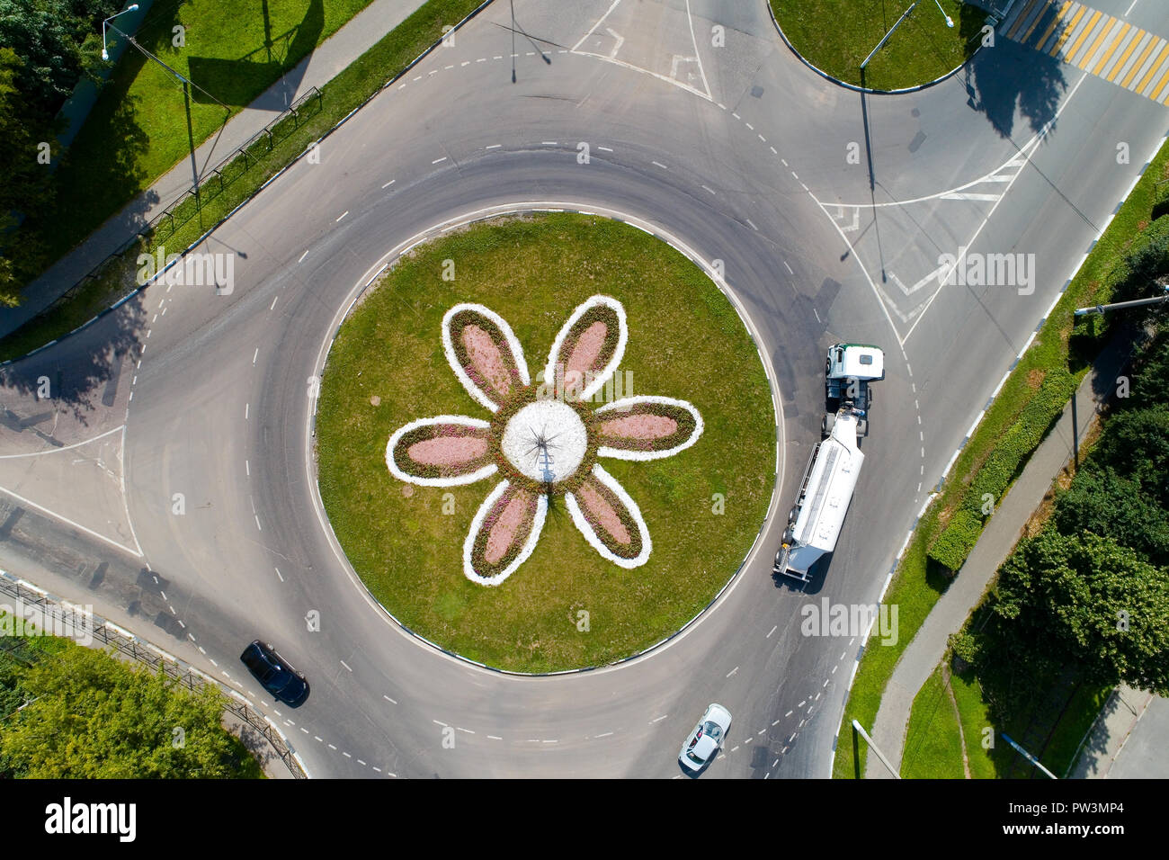 Top view of the road with a circular motion and a flower bed. Aerial ...