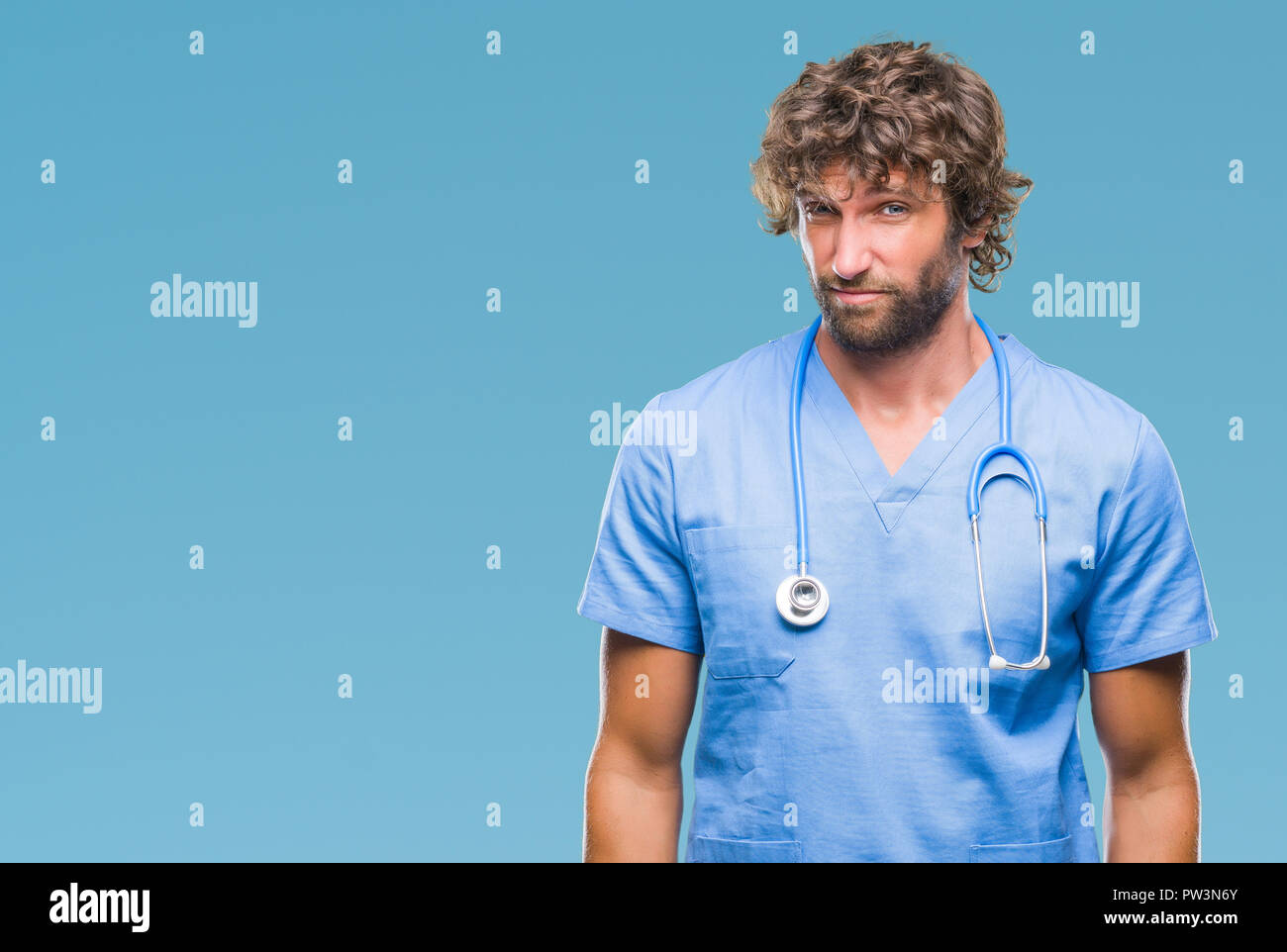 Handsome hispanic surgeon doctor man over isolated background depressed ...