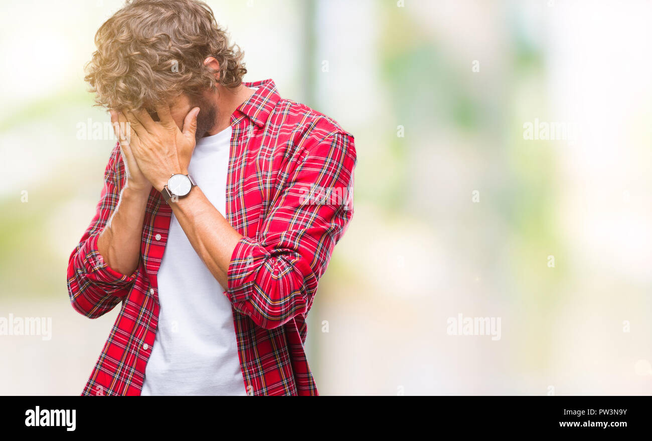 Handsome hispanic model man over isolated background with sad ...