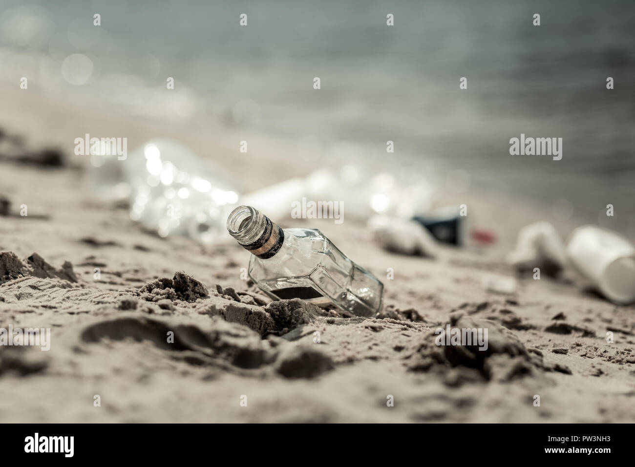 Empty bottle alcohol on beach hi-res stock photography and images - Alamy