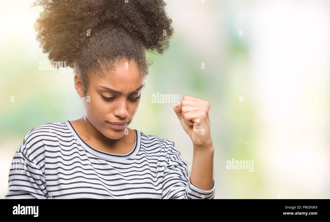 Young afro american woman texting using smartphone over isolated ...
