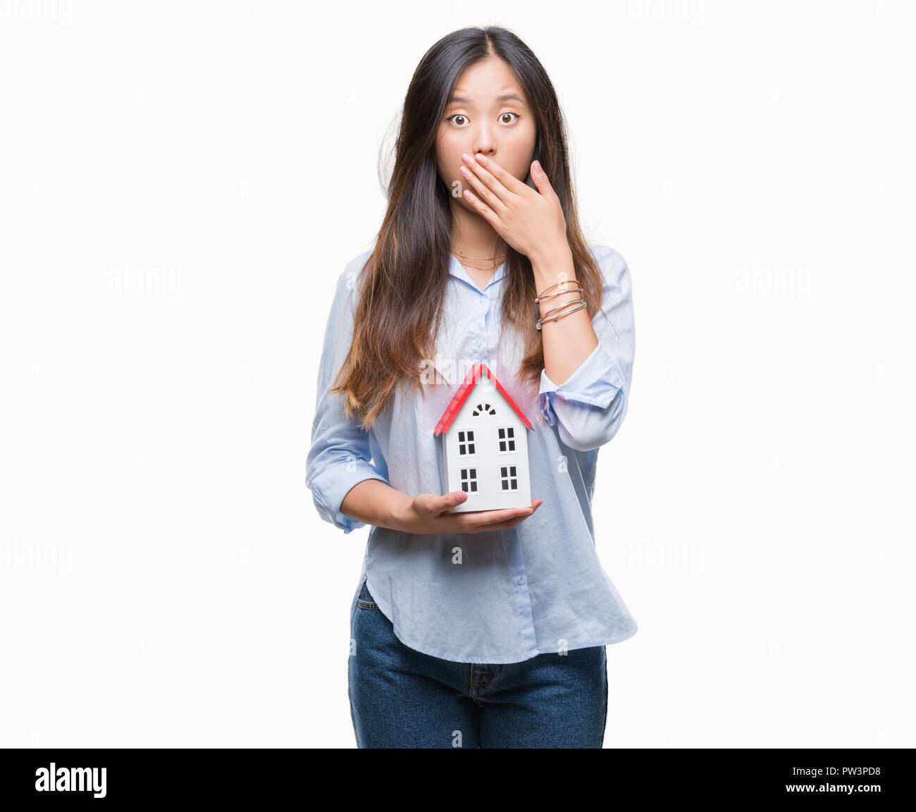 Young asian woman real state agent holding house isolated background ...