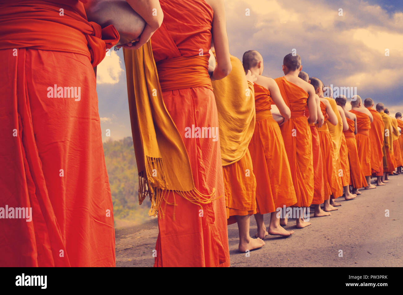 Monks Alms-round or receive food offerings moment. Focus on robe and ...