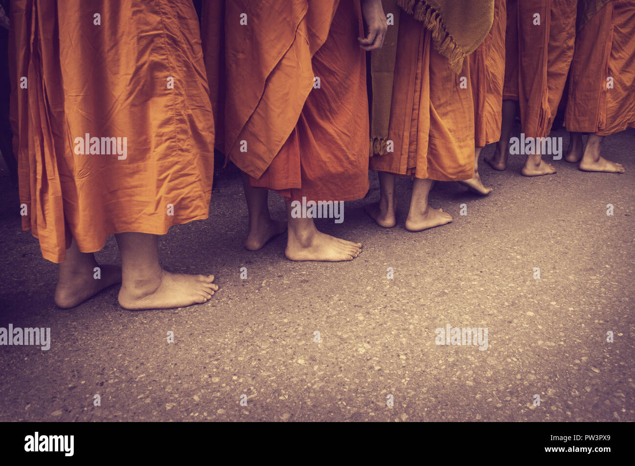 Monks Alms-round or receive food offerings moment. Focus on robe and ...