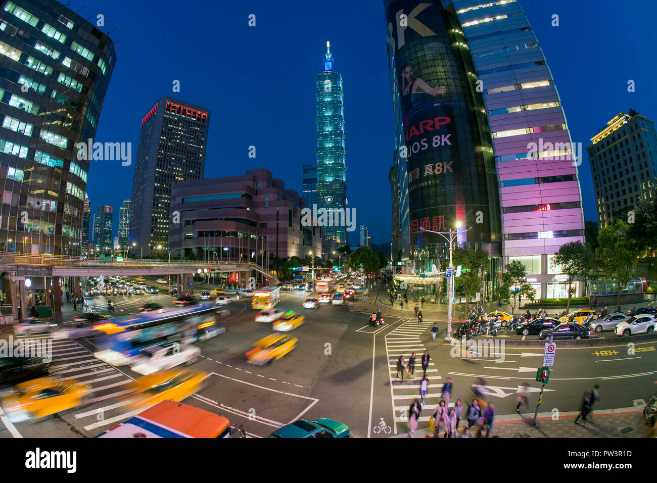 Taiwan, Taipei, traffic in front of Taipei 101 at a busy downtown ...