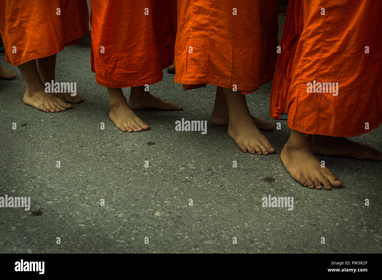 Monks Alms-round or receive food offerings moment. Focus on robe and ...