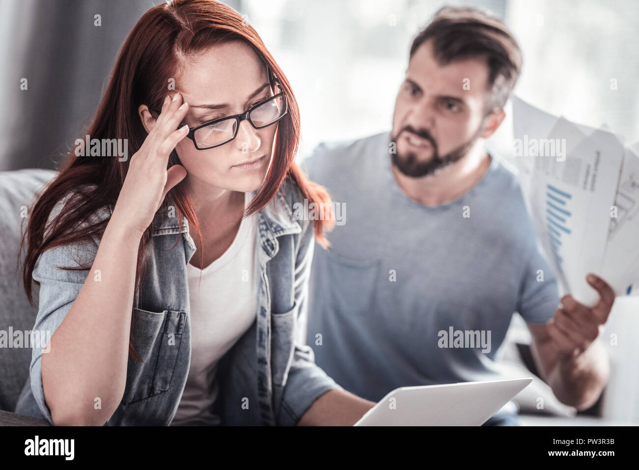 Depressed sad woman holding her forehead Stock Photo - Alamy