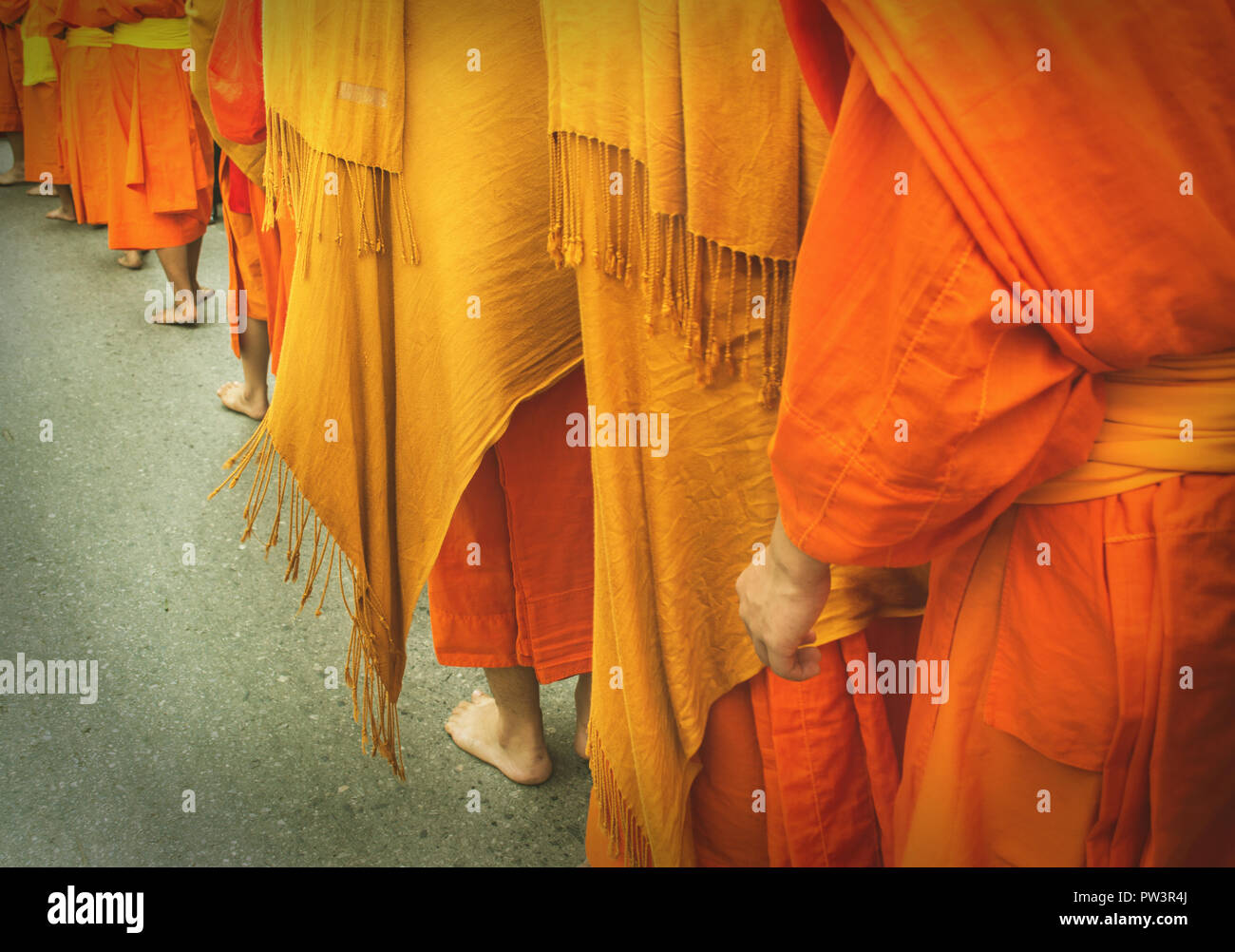 Monks Alms-round or receive food offerings moment. Focus on robe and ...