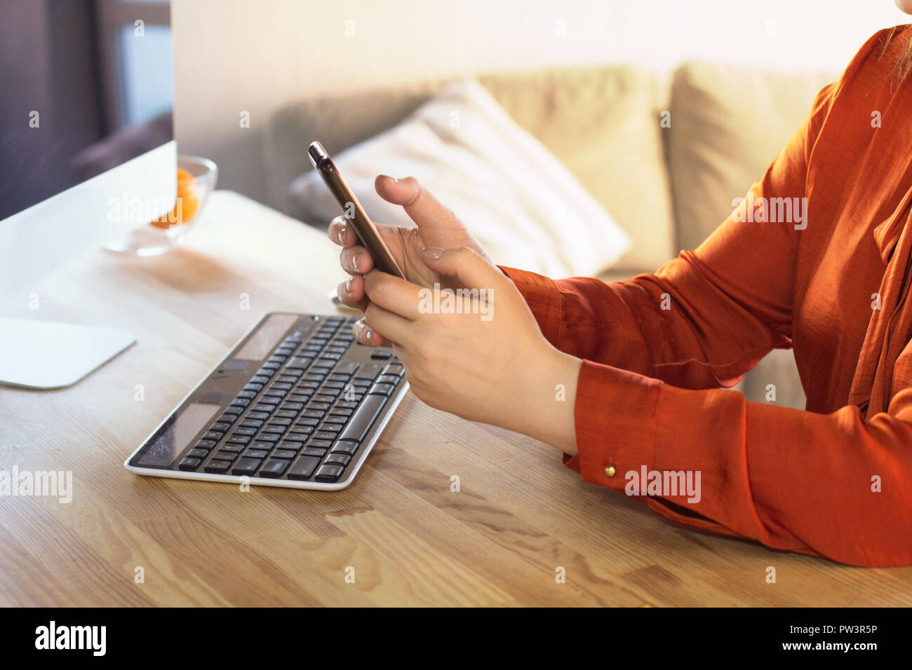 Woman holding smartphone in her hands Stock Photo - Alamy