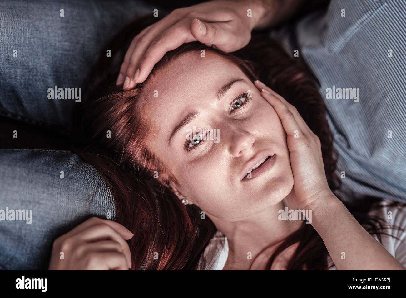 Cheerless gloomy woman holding her cheek Stock Photo - Alamy