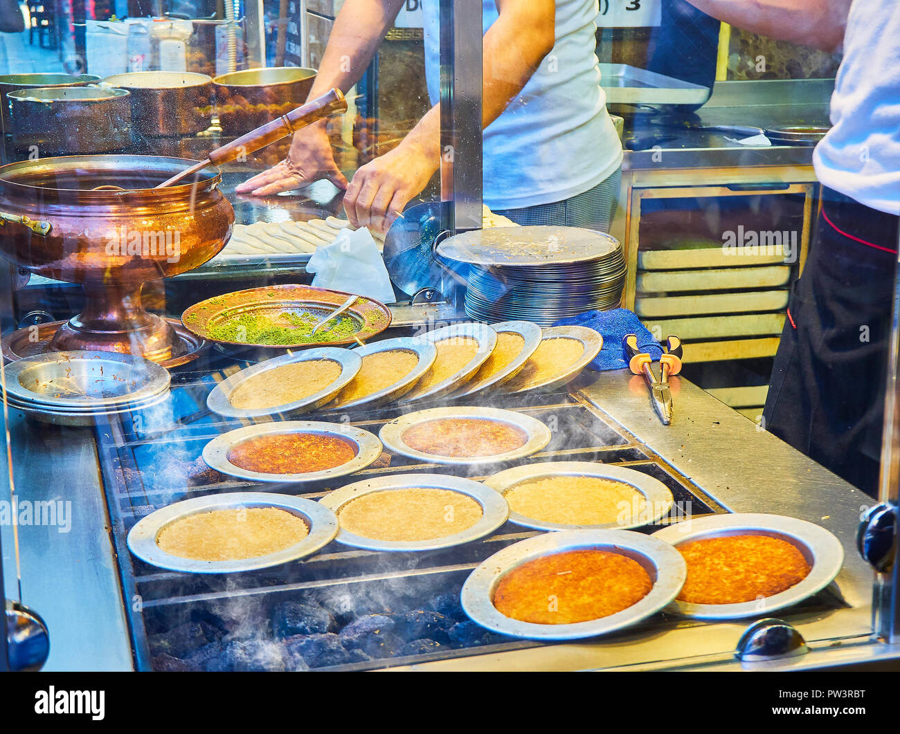 Kunefe, also known as Kenafeh, a traditional Arab dessert made with ...