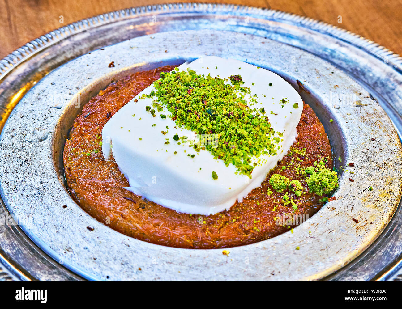 Kunefe, also known as Kenafeh, traditional Arab dessert made with ...