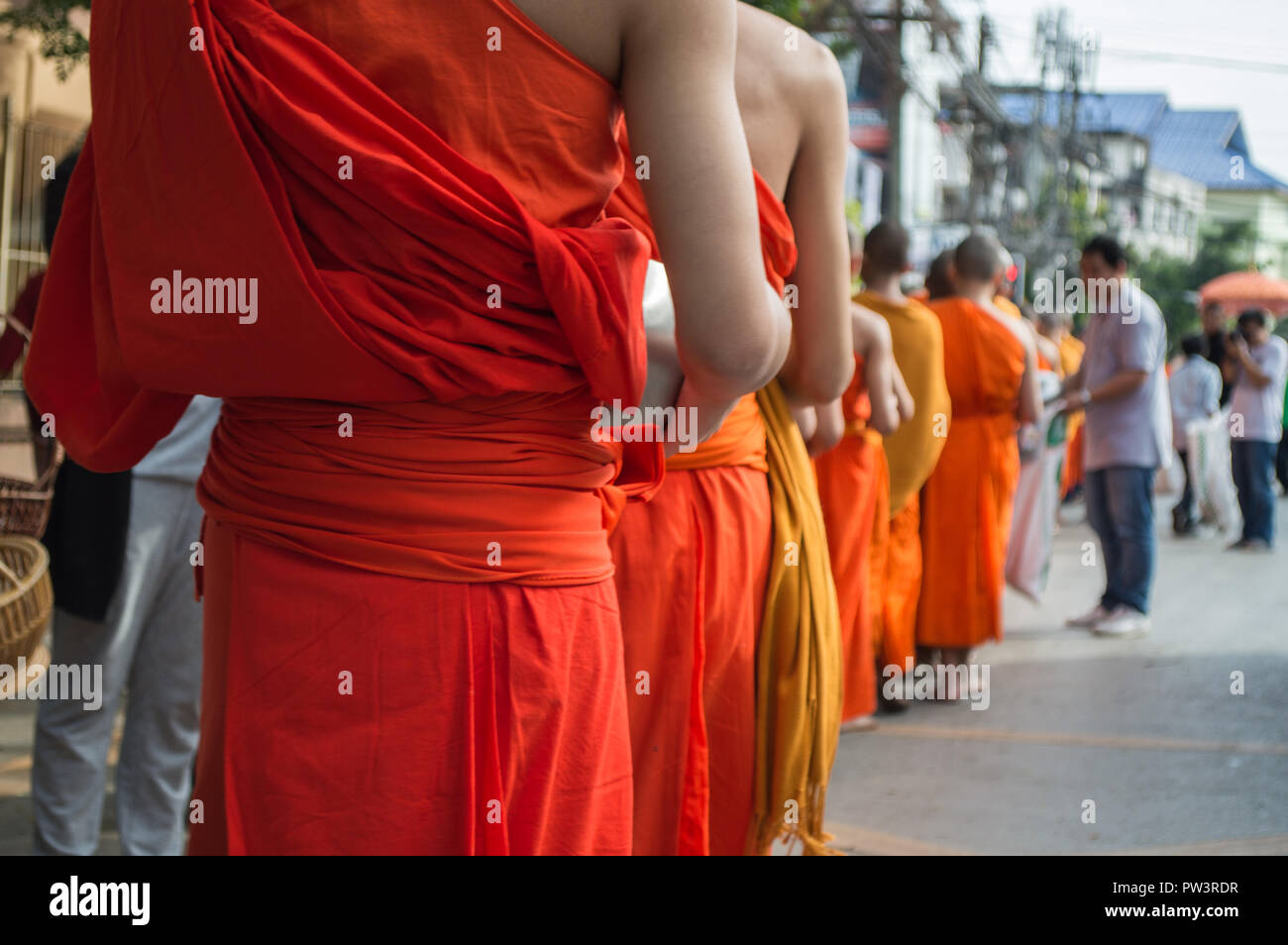 Monks Alms-round or receive food offerings moment Stock Photo - Alamy