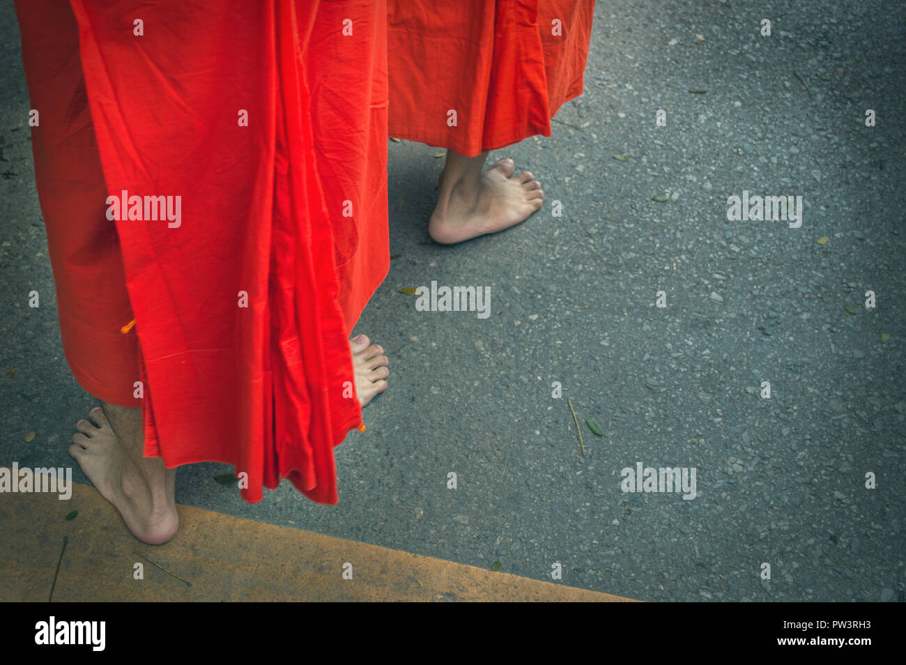 Monks Alms-round or receive food offerings moment. Focus on robe and ...