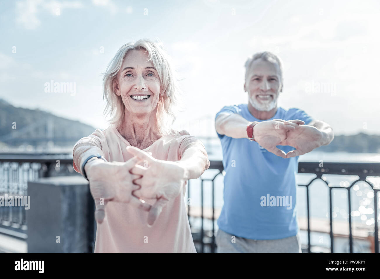 Man and woman locking their hands Stock Photo - Alamy
