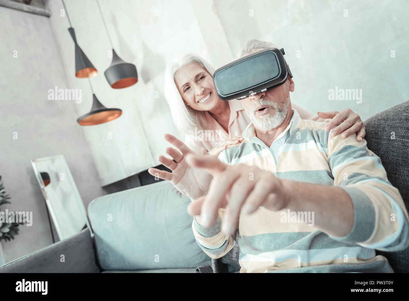 Happy excited man pointing with his finger Stock Photo - Alamy