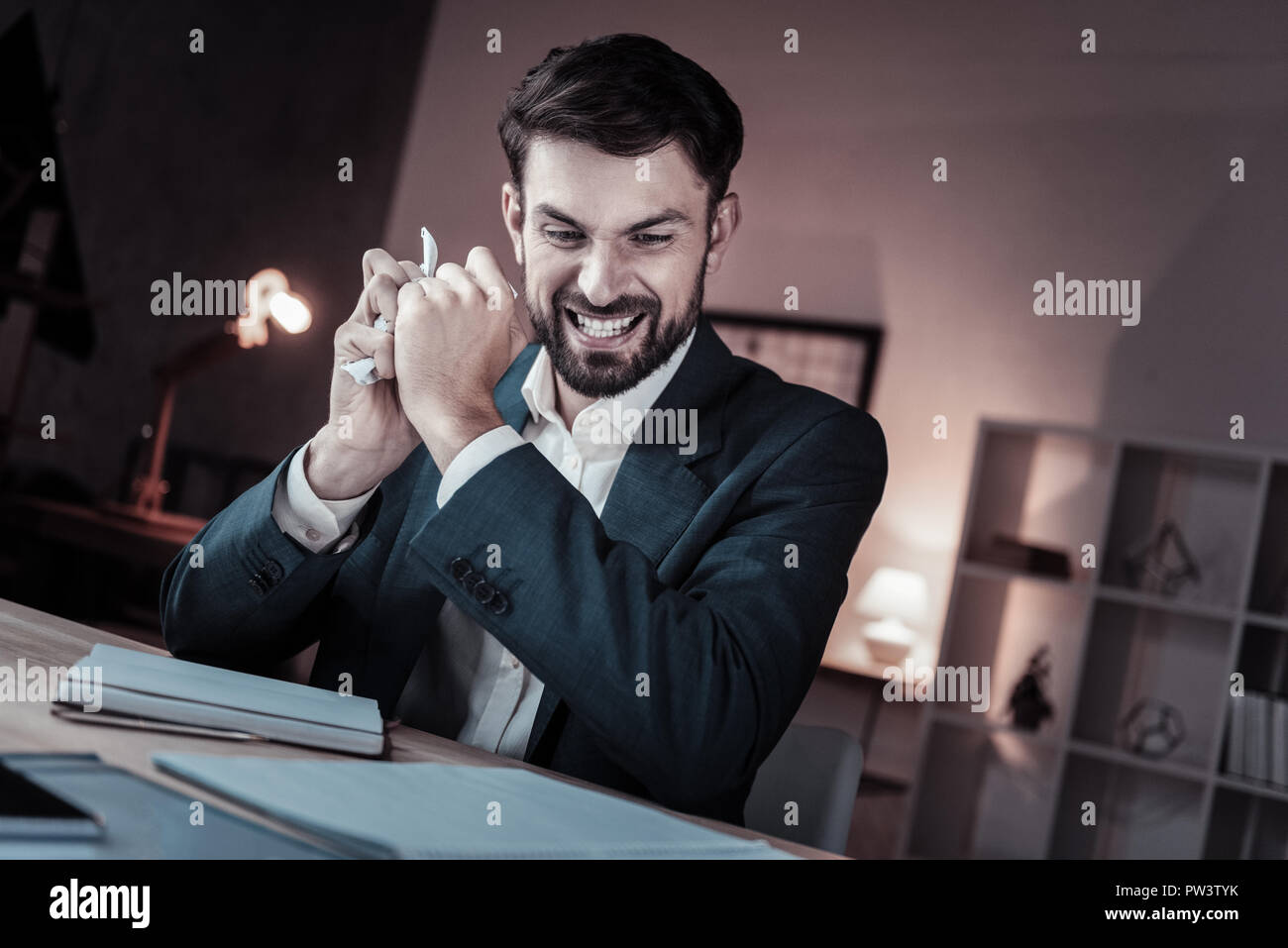 Angry male person tearing paper in pieces Stock Photo - Alamy