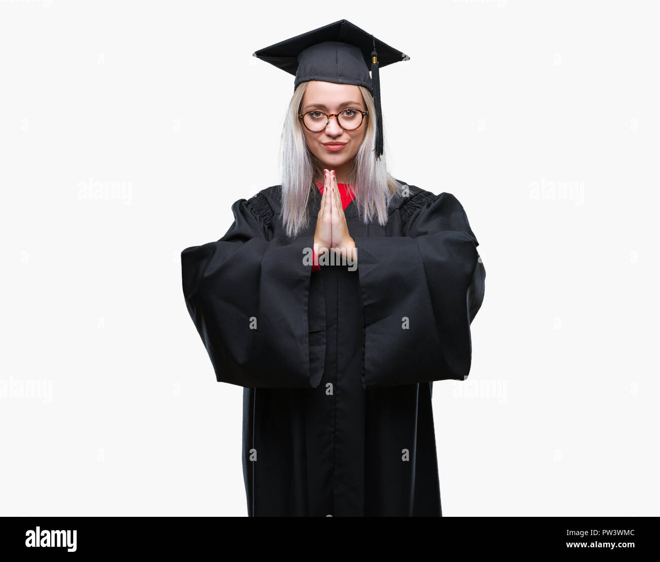 Young blonde woman wearing graduate uniform over isolated background ...