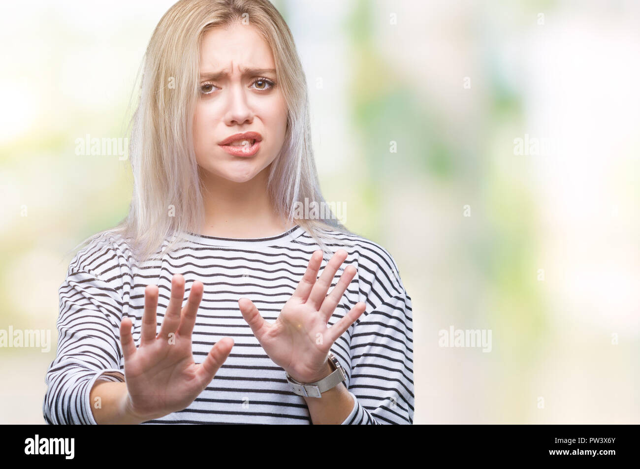 Young blonde woman over isolated background disgusted expression ...