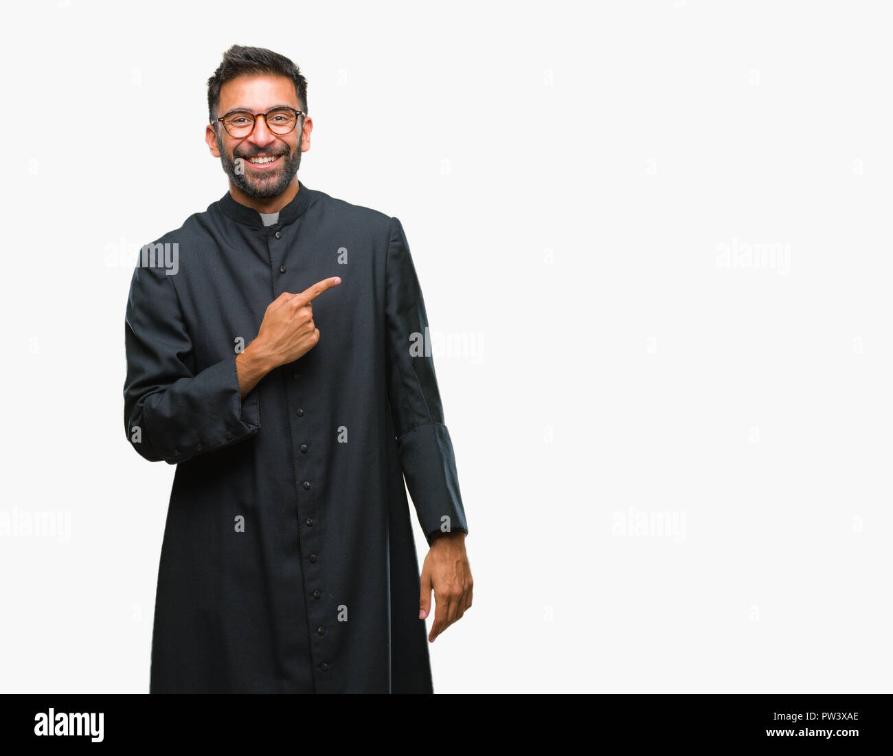 Adult hispanic catholic priest man over isolated background cheerful ...