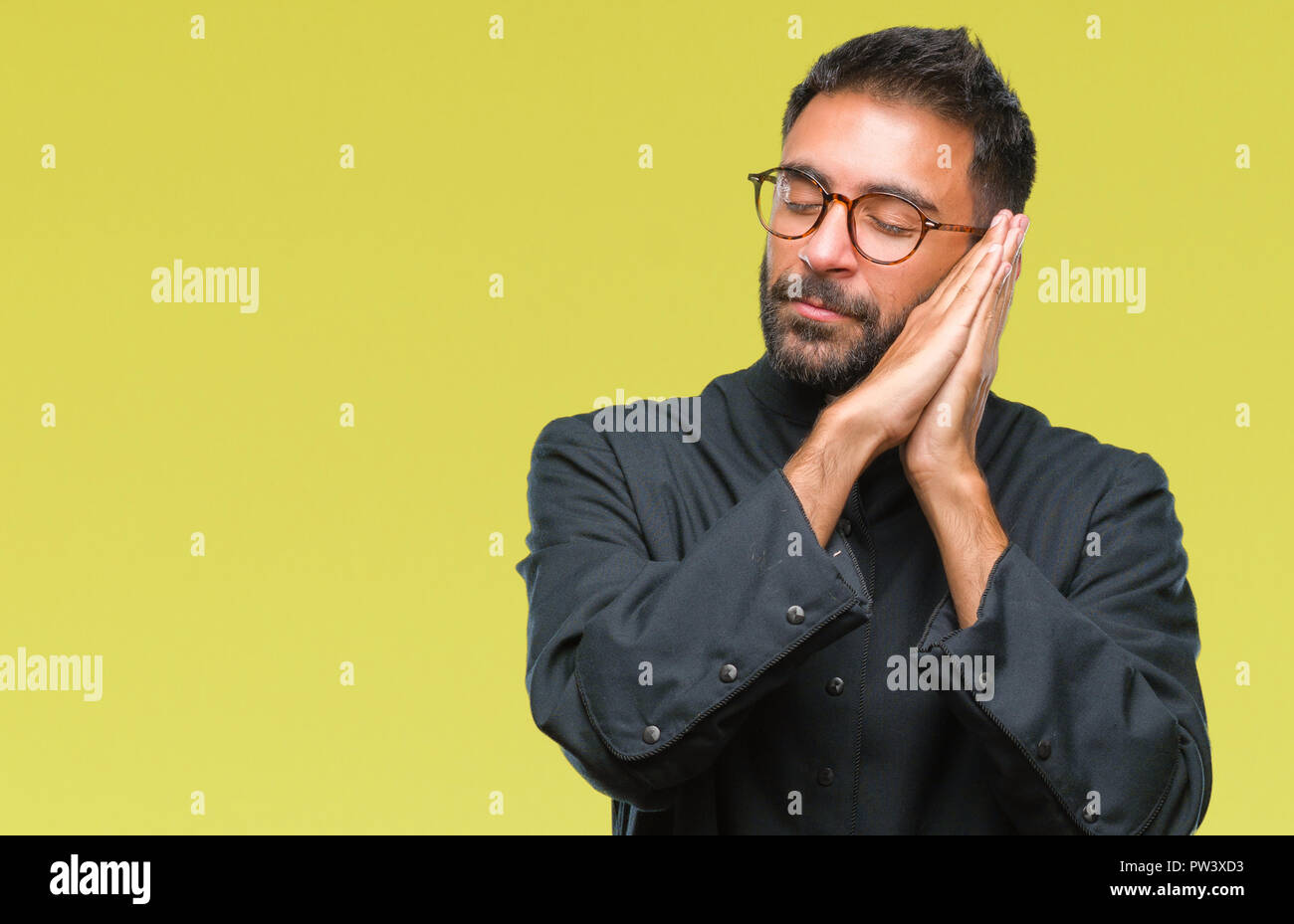 Adult hispanic catholic priest man over isolated background sleeping ...