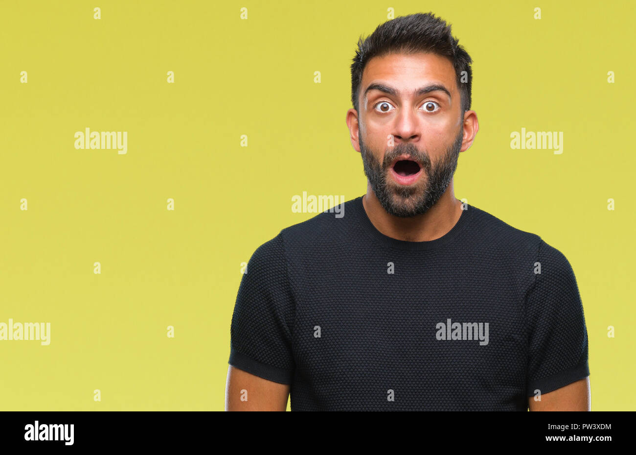 Adult hispanic man over isolated background afraid and shocked with ...