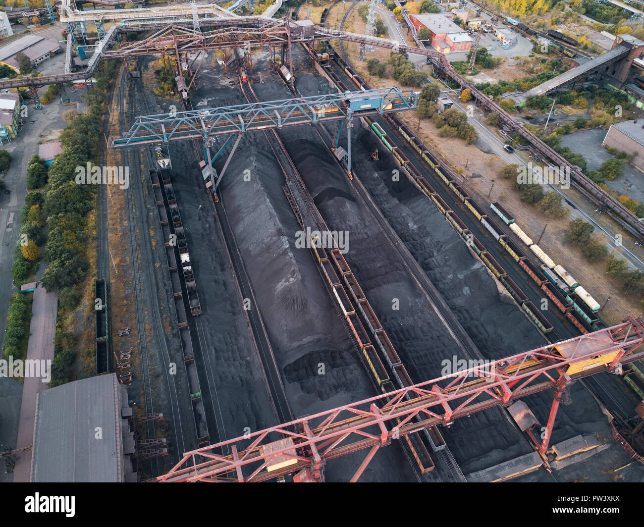 Drone faerial view of moving train with production for export on the ...