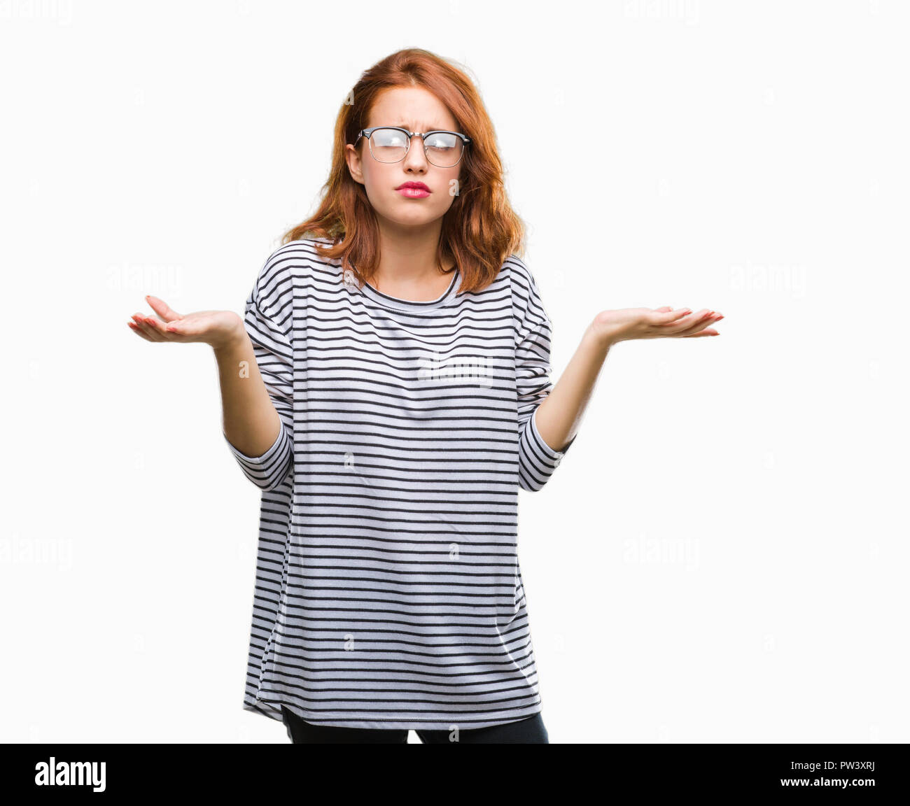 Young beautiful woman over isolated background wearing glasses clueless ...