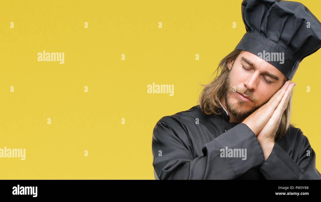 Young handsome cook man with long hair over isolated background ...