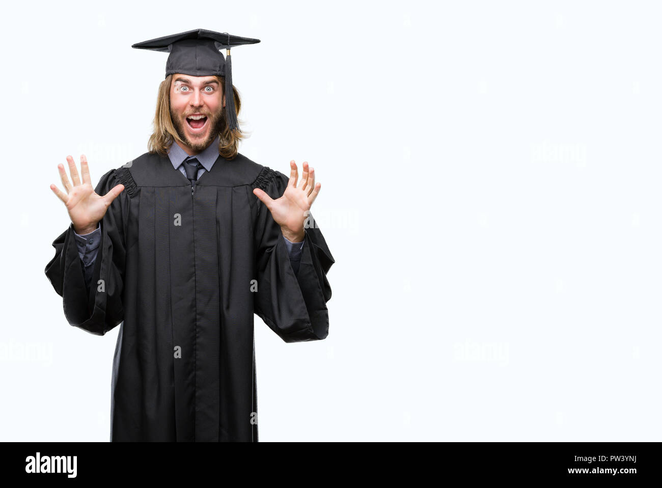 Young handsome graduated man with long hair over isolated background ...