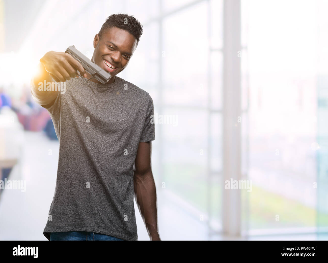 Man smile gun to head hi-res stock photography and images - Alamy