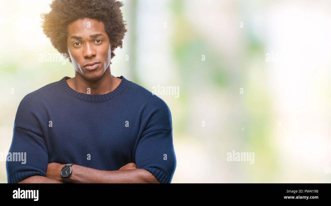 Afro american man over isolated background skeptic and nervous ...
