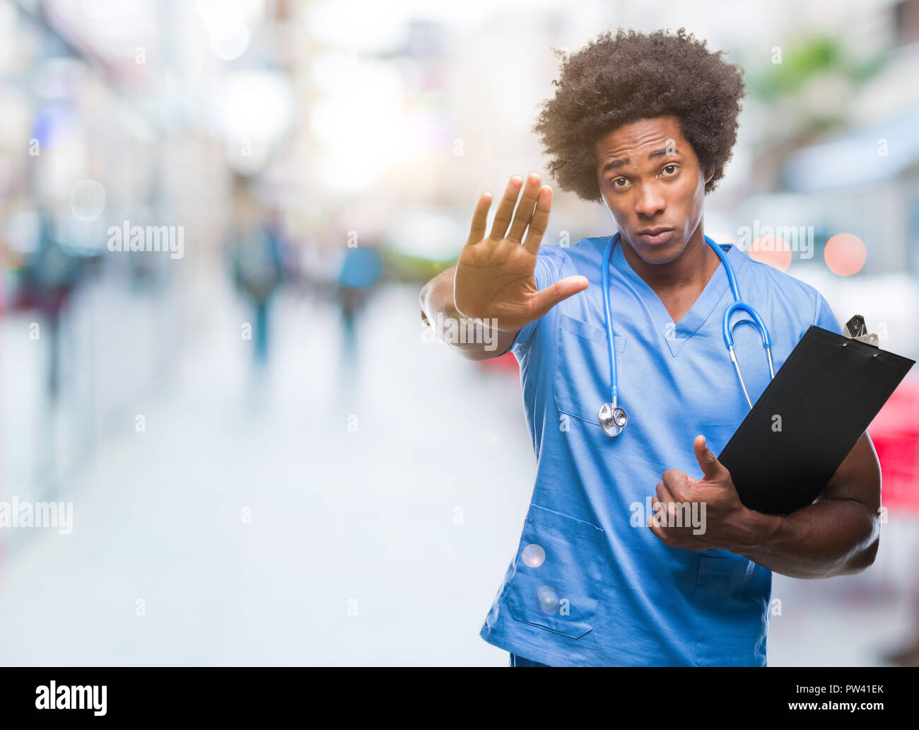 Afro american surgeon doctor holding clipboard man over isolated ...